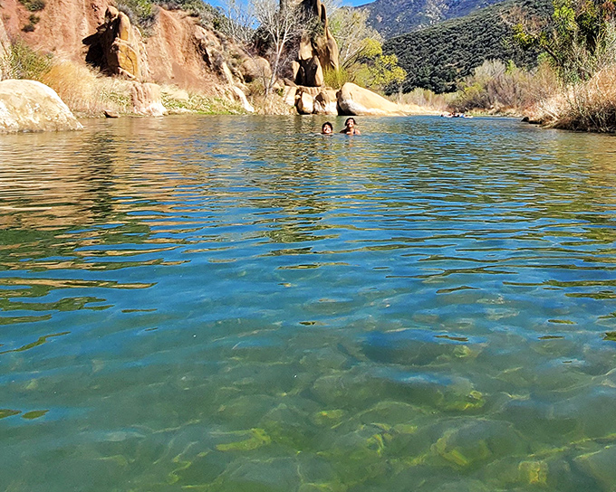 Mother Nature's infinity pool puts those fancy resort versions to shame. Crystal clear waters reflect the sky while sandstone cliffs stand guard.