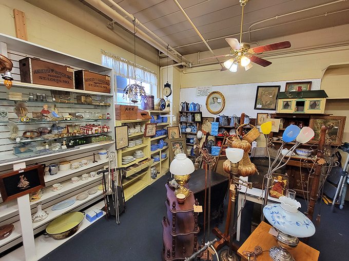 Every shelf tells a story in this dealer's booth, where vintage lamps illuminate collections of dishware and knickknacks waiting for their second chapter.