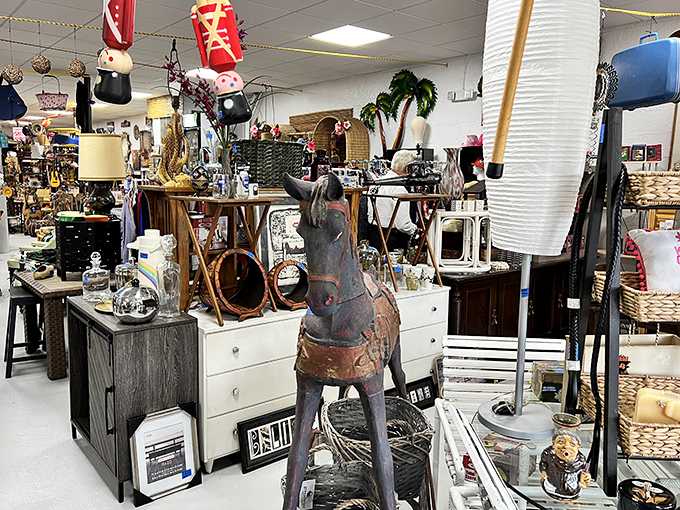 A wooden rocking horse stands sentinel among the furniture vignettes, silently watching decades of style come and go.