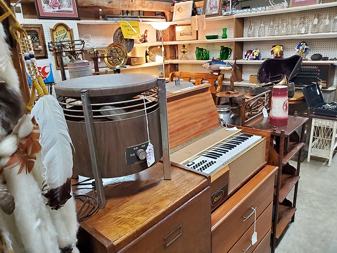 Musical history on display! This vintage organ keyboard sits among wooden treasures, each with stories to tell from decades past.