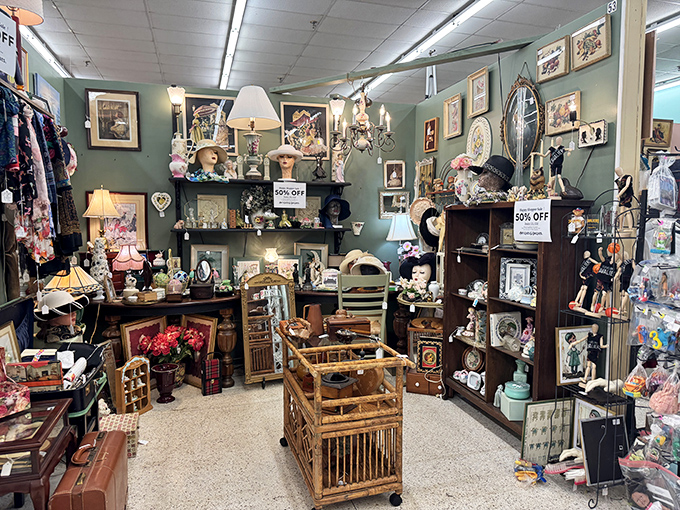 This vendor booth is what happens when your stylish great-aunt's attic decides to put on its Sunday best. Note the vintage wooden playpen&mdash;baby jail never looked so charming!