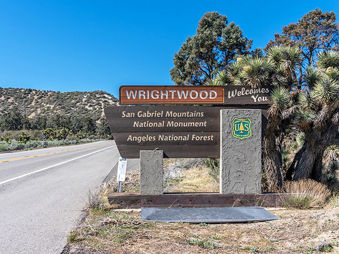 This welcoming sign marks the transition from ordinary life to mountain magic, where cell service fades and smiles grow.