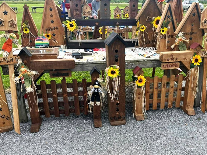 Rustic birdhouses adorned with cheerful sunflowers stand at attention like tiny wooden soldiers. Home sweet home for feathered friends and country decor enthusiasts alike.