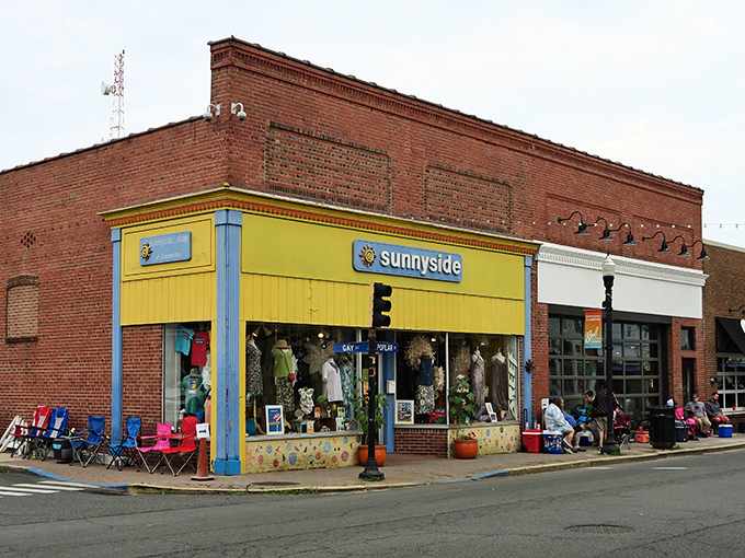 A vibrant corner shop named "Sunnyside" brightens the historic streets of Cambridge, Maryland, inviting locals and visitors with colorful clothing and cheerful charm.