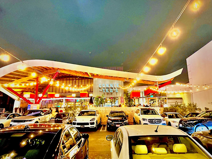 Connie and Ted's modern exterior glows with invitation after dark. This West Hollywood hotspot transforms New England seafood classics into California dreams.