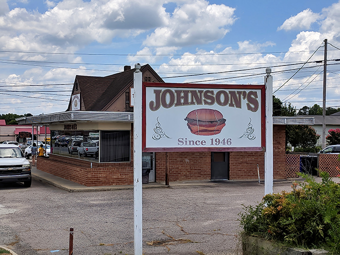Johnson's Drive-In, where time stands deliciously still. That vintage sign has been guiding hungry travelers since Truman was president.