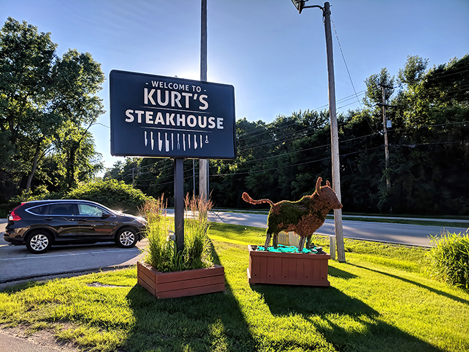 Kurt's Steakhouse sign stands like a beacon for the beef-obsessed. That metal bull knows exactly what you came for.