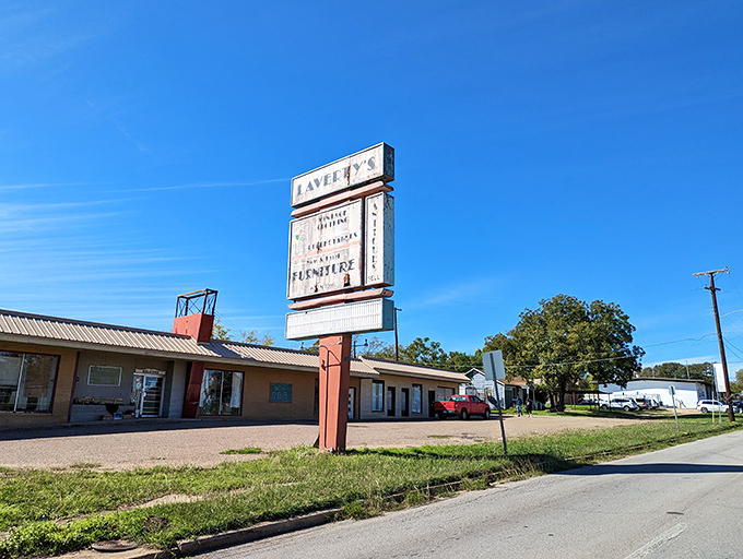 Roadside nostalgia alert! Laverty's sign stands like a sentinel, beckoning collectors to the treasures within.