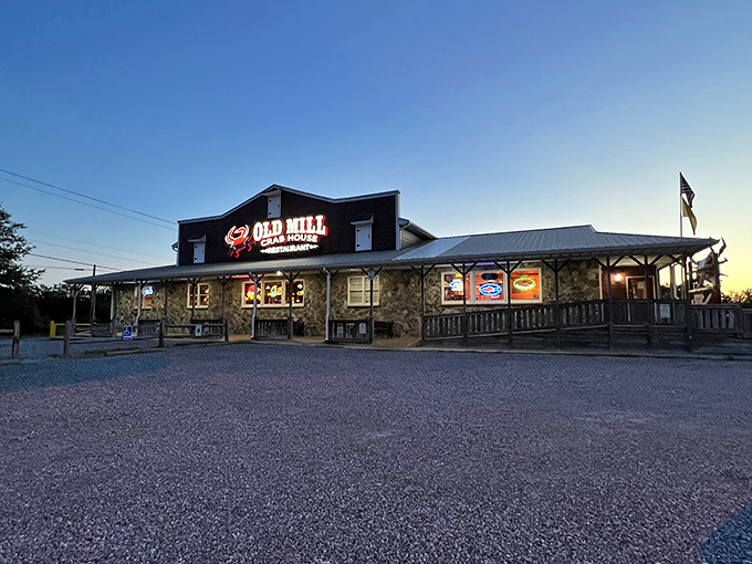 Old Mill Crab House glows at dusk like a seafood sanctuary. That stone-and-wood charm has welcomed hungry visitors for generations.