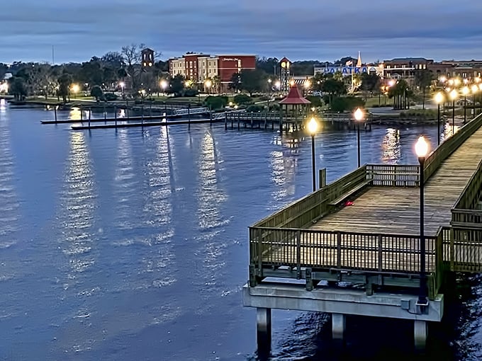 Palatka's riverfront boardwalk glimmers at twilight, proving waterfront magic doesn't require a millionaire's budget.