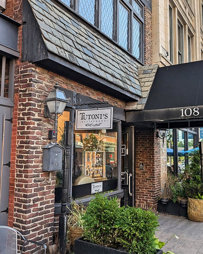 Tucked behind that historic brick facade, Tutoni's serves up Italian seafood magic that would make nonna weep with joy.