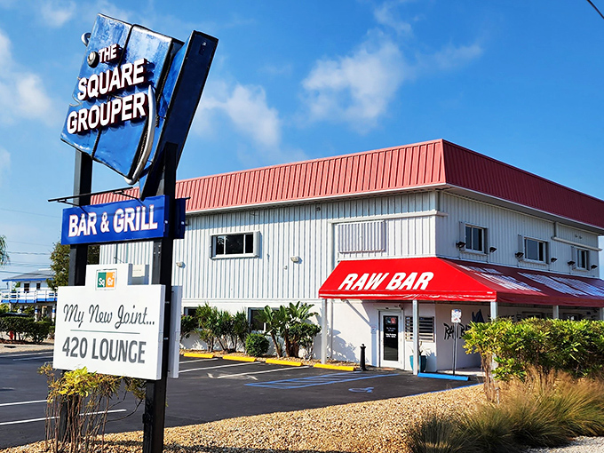 The Square Grouper's sign stands tall against the Florida sky, promising seafood worth the drive. No fancy harbor views needed when the sandwich is this good!