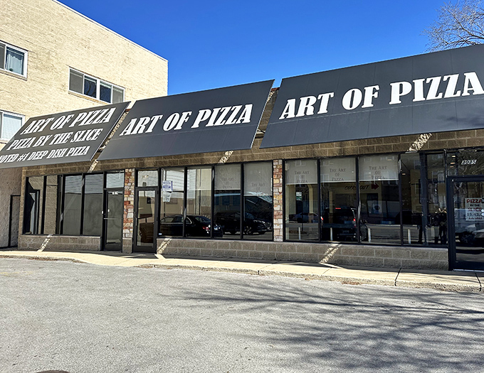 Art of Pizza's bold signage makes a promise that their deep-dish masterpieces absolutely deliver on.