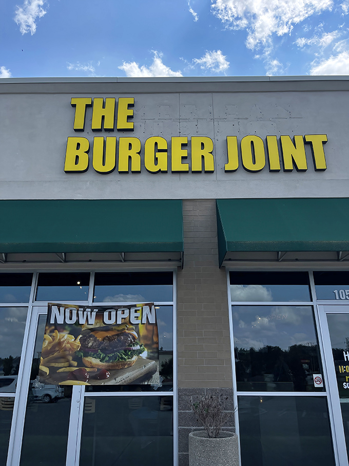 The Burger Joint's bright yellow sign is like a beacon of hope for the burger-deprived. Simple outside, spectacular inside!