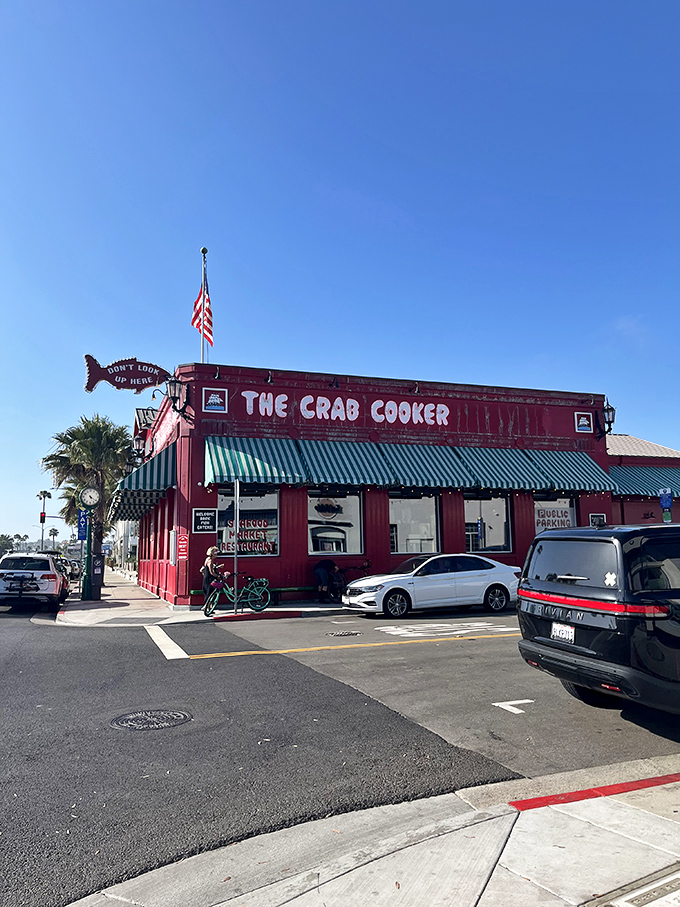 The Crab Cooker's fire-engine red exterior stands out like a lighthouse for hungry sailors. This Newport Beach landmark practically screams "fresh seafood inside!"