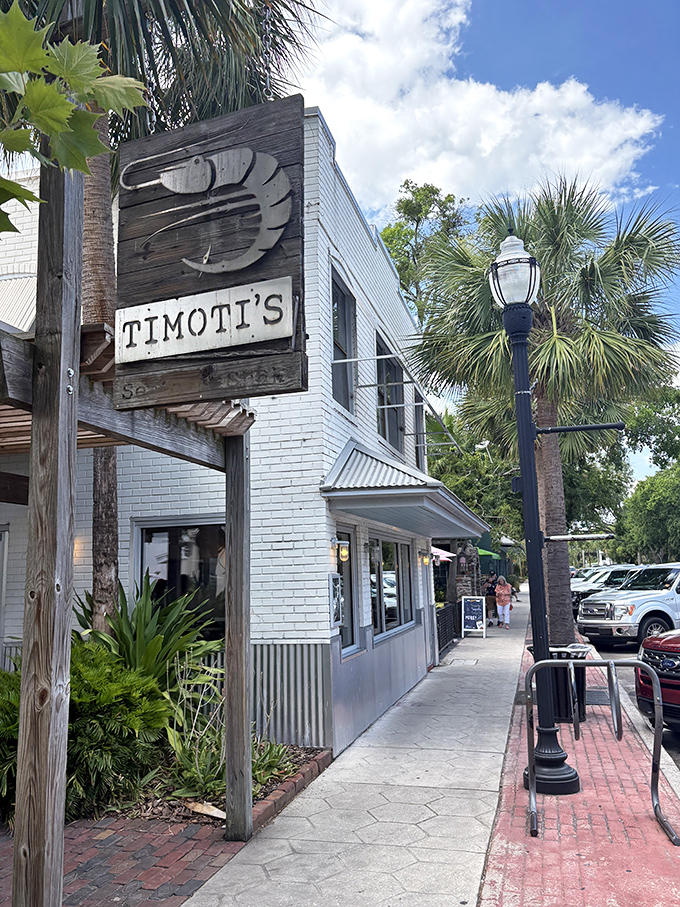 Timoti's wooden shrimp sign swings gently in the breeze, a siren call to seafood lovers wandering Fernandina Beach's brick-lined streets.