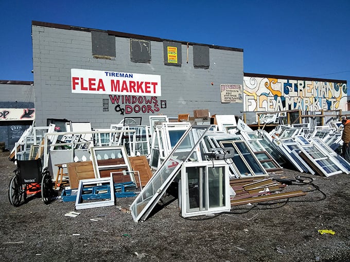 Home improvement treasure hunting at Tireman Flea Market, where rows of reclaimed windows and doors await your next project.
