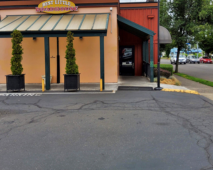 The entrance says it all: no fuss, just great food ahead. Those potted trees stand guard over some of Salem's finest steaks.