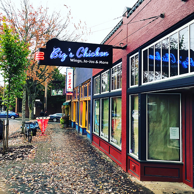The neon blue sign beckons chicken lovers like a lighthouse guiding hungry sailors to crispy, smoky shores.