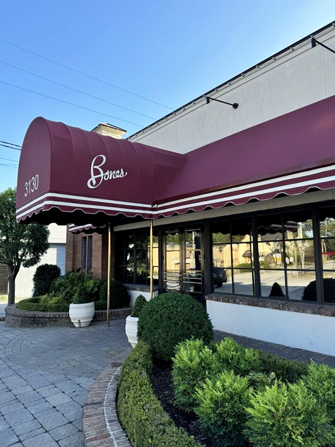 That deep burgundy canopy isn't just an awning—it's a beacon calling to serious steak enthusiasts across Atlanta.