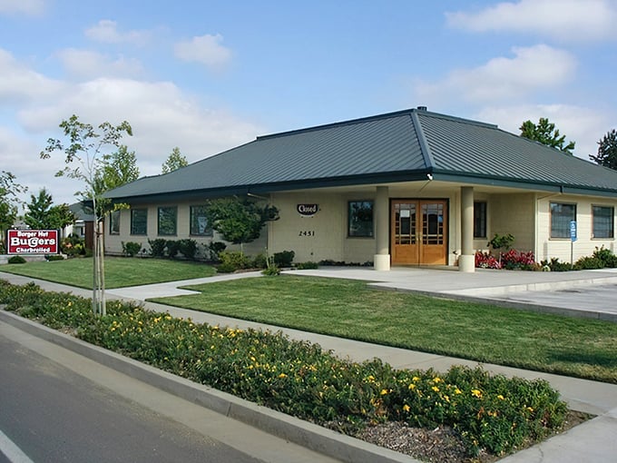 Neat landscaping surrounds this unassuming burger paradise, where patties are hand-formed and memories are made daily.
