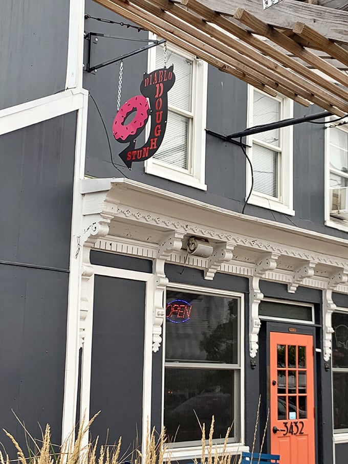 Navy blue building, bright orange door &ndash; Diablo knows dramatic entrances matter almost as much as their heavenly donuts.