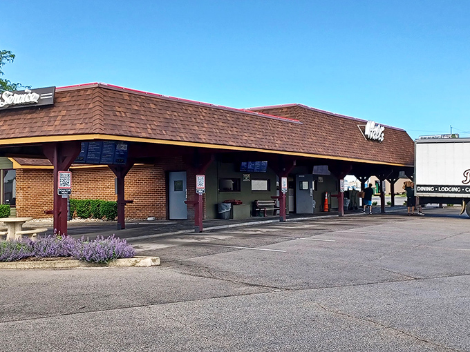 The covered drive-through promises comfort in any weather, like a warm hug from your favorite aunt.