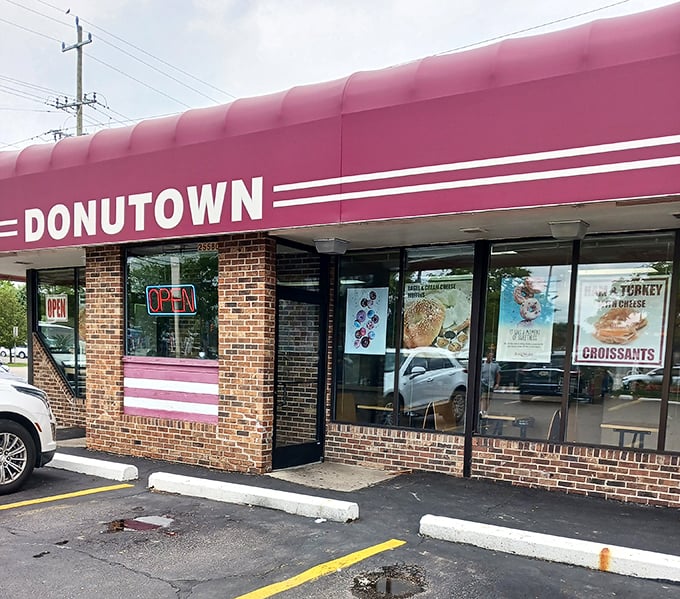 Donutown's storefront has that classic "you know it's good" look &ndash; brick, stripes, and a promise of handcrafted delights behind those doors.