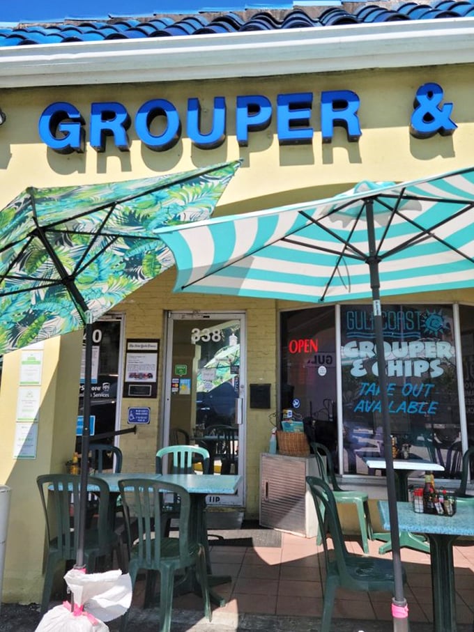 The bright blue sign promises exactly what you'll get: perfectly prepared grouper that makes you forget you're dining in a strip mall.