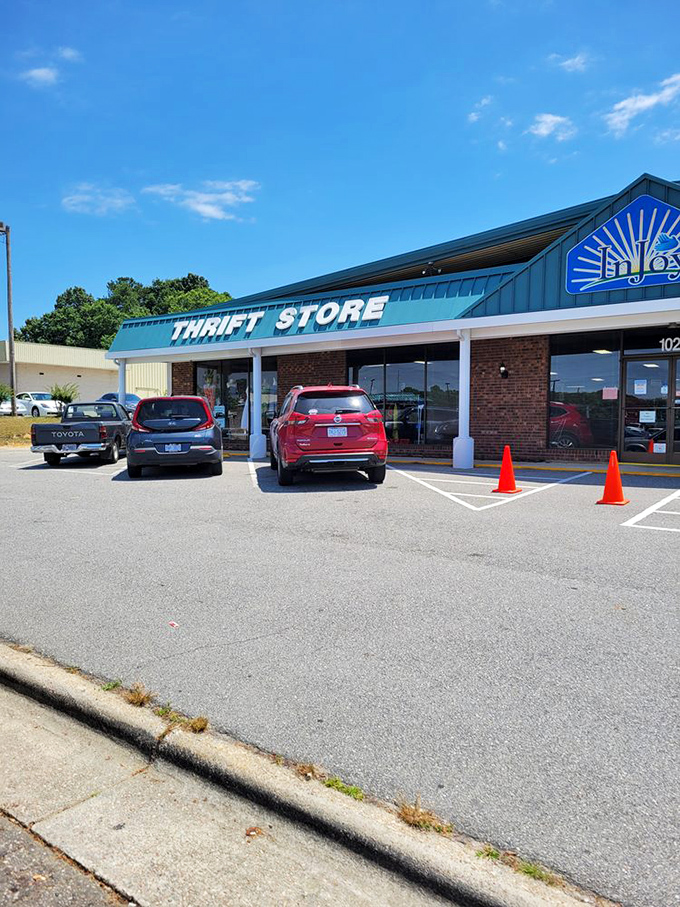 Morning light bathes InJoy's welcoming storefront, where the blue awning promises cool deals on even the hottest Carolina days.