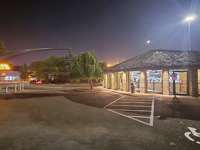 By day or night, this circular burger sanctuary beckons hungry travelers with the promise of hand-formed patties and custard so creamy it defies physics.