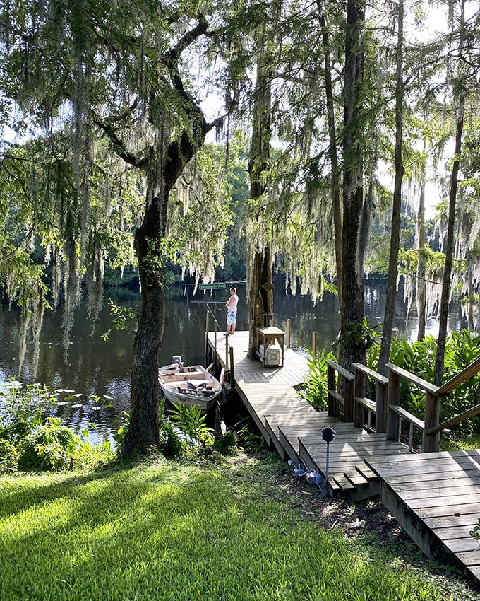 Nature meets comfort in Ocala. Spanish moss drapes these ancient trees like Mother Nature's own decorating touch around this peaceful fishing spot.