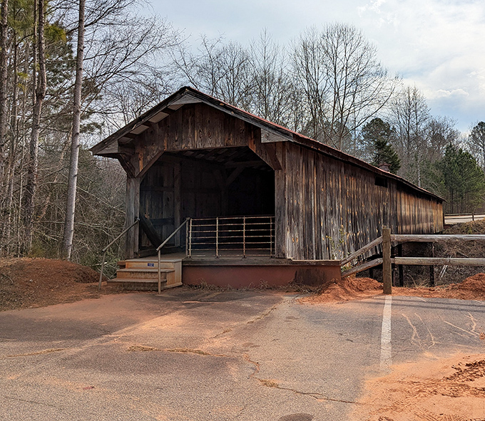 Ole Gilliam's wooden gateway stands ready for your next country drive. The kind of place that makes you slow down&mdash;by design.