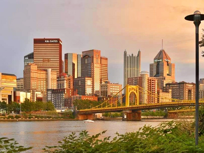The City of Bridges shows off at sunset! Pittsburgh's skyline glows like it's trying to outshine its own golden bridges.
