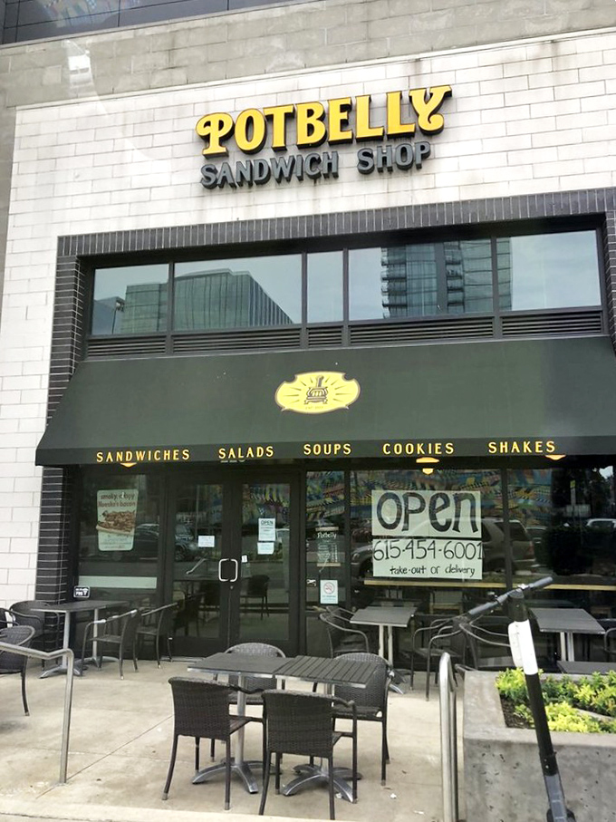 That yellow awning signals sandwich salvation&mdash;where toasted bread meets fresh ingredients in a harmony sweeter than any Nashville tune.