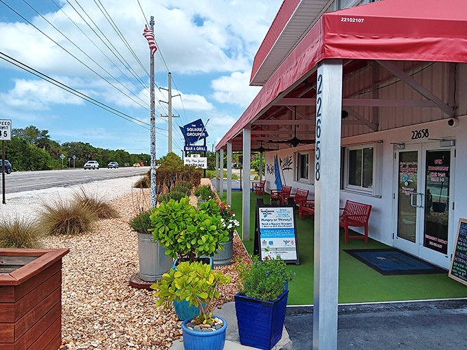 Red awning, cold drinks, and grouper that makes you question why you'd ever eat anything else. This place understands the Florida assignment perfectly.