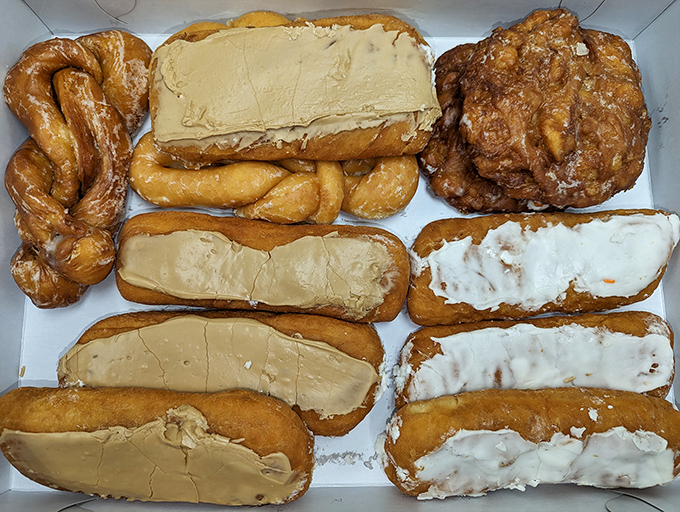 Donut heaven comes in cardboard boxes. This assortment of long johns and fritters isn't just breakfast—it's edible therapy for whatever ails you.