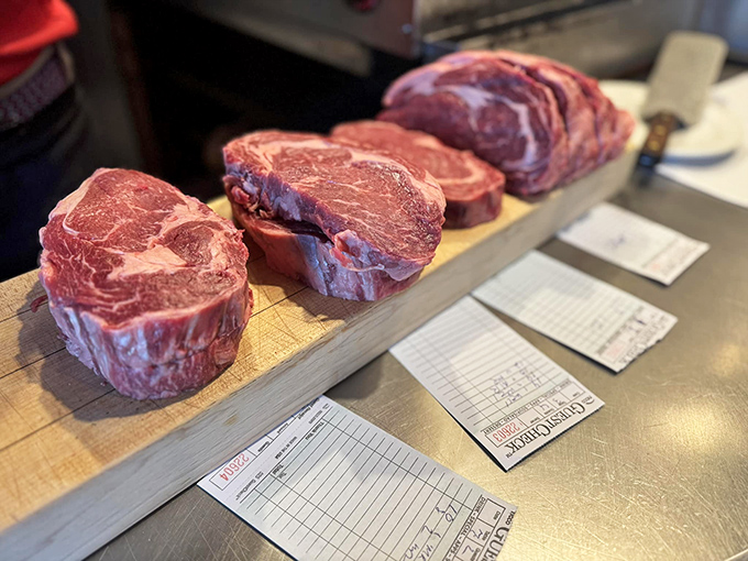 These slabs of prime rib await their destiny on a wooden board. Selecting your cut is like choosing which masterpiece to take home from the Louvre.