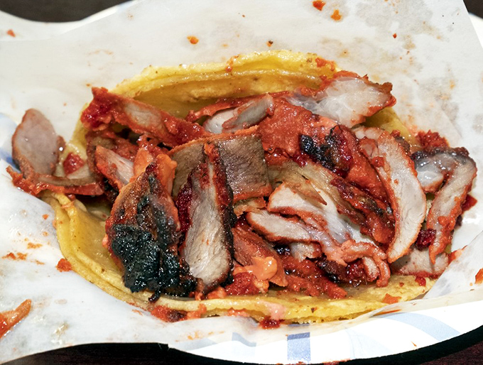 Behold the adobada masterpiece: layers of marinated pork that would make your abuela weep with joy. 