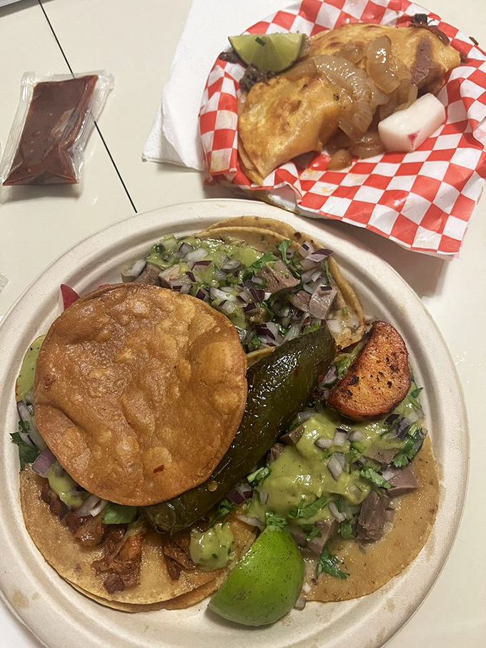 Taco perfection doesn't happen by accident. Fresh cilantro, diced onion, and a squeeze of lime elevate these handmade treasures to art.