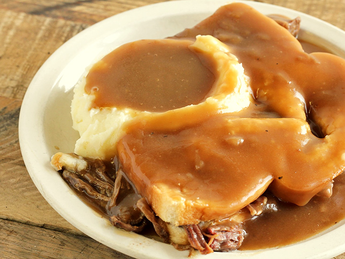 Hot roast beef with mashed potatoes and gravy&mdash;the holy trinity of comfort food. This plate doesn't just feed your body; it nourishes your soul.