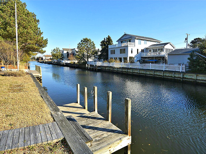 Wooden docks line the canals like friendly neighbors, each one a gateway to water adventures or simply the perfect spot for morning coffee.