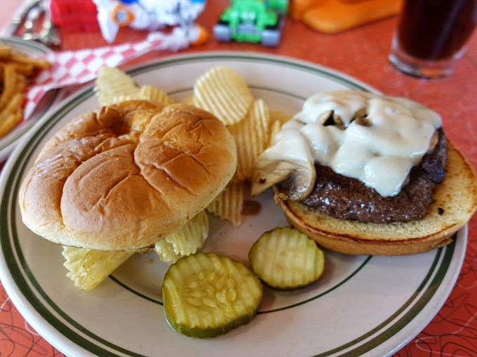 This isn't just a burger &ndash; it's a masterpiece of melted cheese cascading over a perfectly seared patty. The pickles add that essential tang.