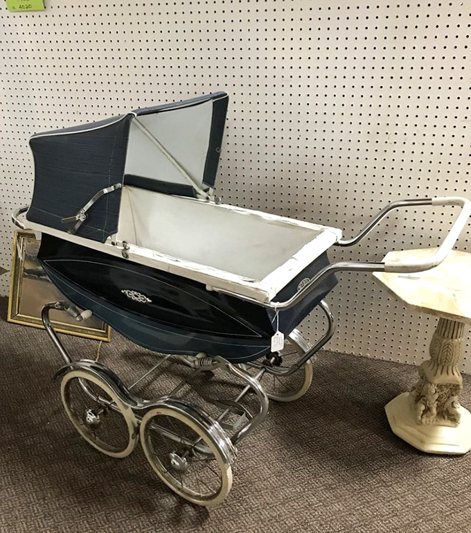 This vintage baby carriage isn't just transportation; it's a rolling time capsule from an era when "taking baby for a stroll" was a neighborhood event.