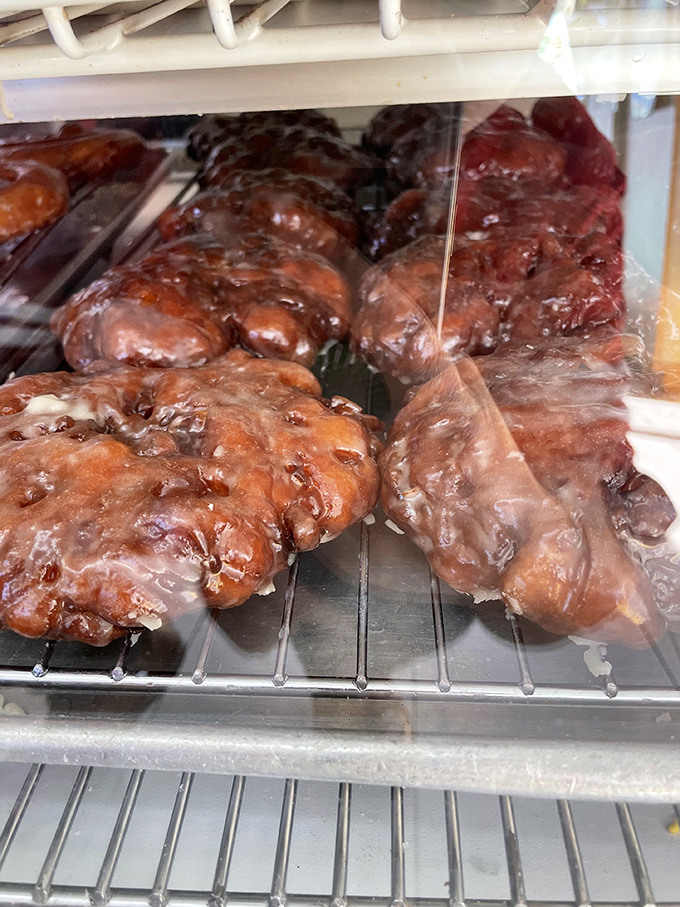 Apple fritters: those magnificent, craggy islands of caramelized perfection. Each bite offers a textural adventure worthy of its own documentary series.