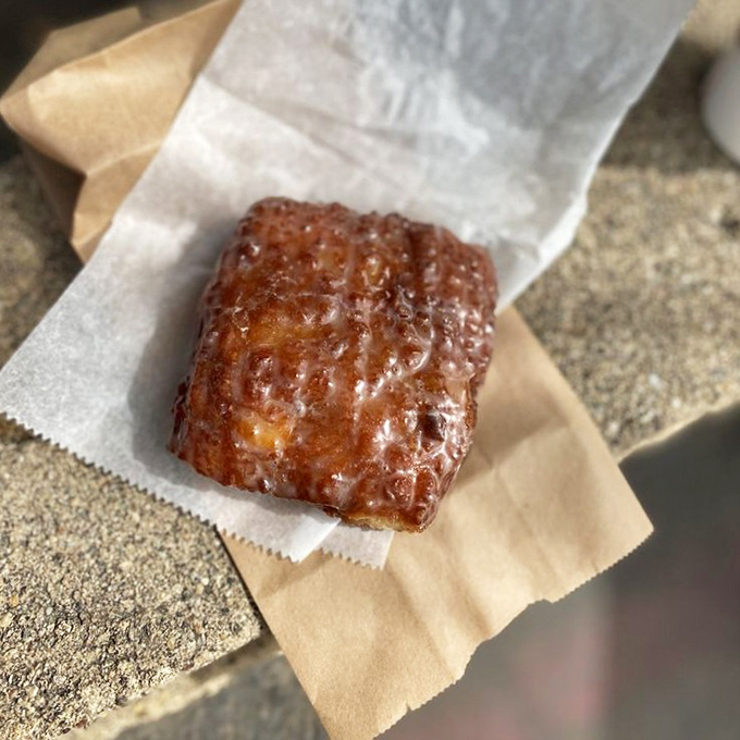 This isn't just an apple fritter &ndash; it's a glistening monument to what happens when apples, cinnamon, and dough achieve perfect harmony.