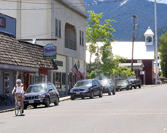Cyclists own the road in a town where rush hour is defined differently. The mountains stand guard over this peaceful valley sanctuary.