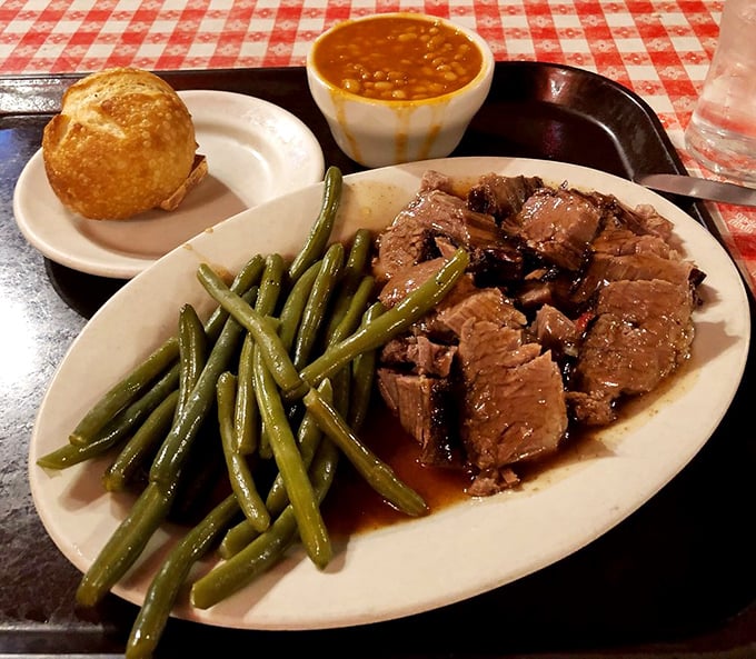 This brisket doesn't just fall apart&mdash;it surrenders completely, waving a white flag of deliciousness alongside those perfectly cooked green beans.