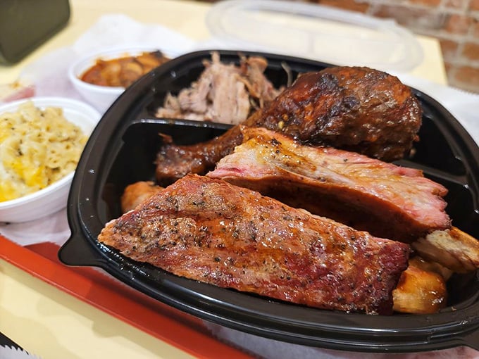 Behold the carnivore's dream team! These ribs showcase that perfect pink smoke ring&mdash;nature's way of telling you someone really knows what they're doing.