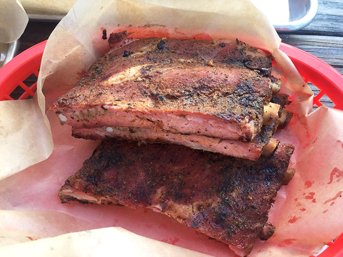 These ribs don't just fall off the bone &ndash; they perform a graceful swan dive into barbecue immortality with that perfect pink smoke ring.